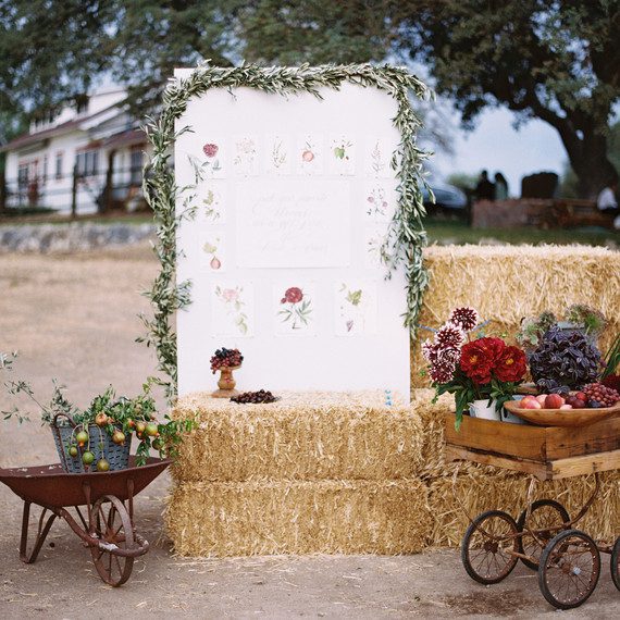 Create a cute photo booth yourself with a few bales of hay and white ...